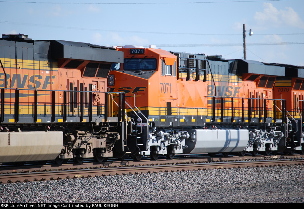 BNSF 7071 Heads east as a #2 unit with BNSF 7070 behind Her as a #3 unit on a eastbound Stack Train.